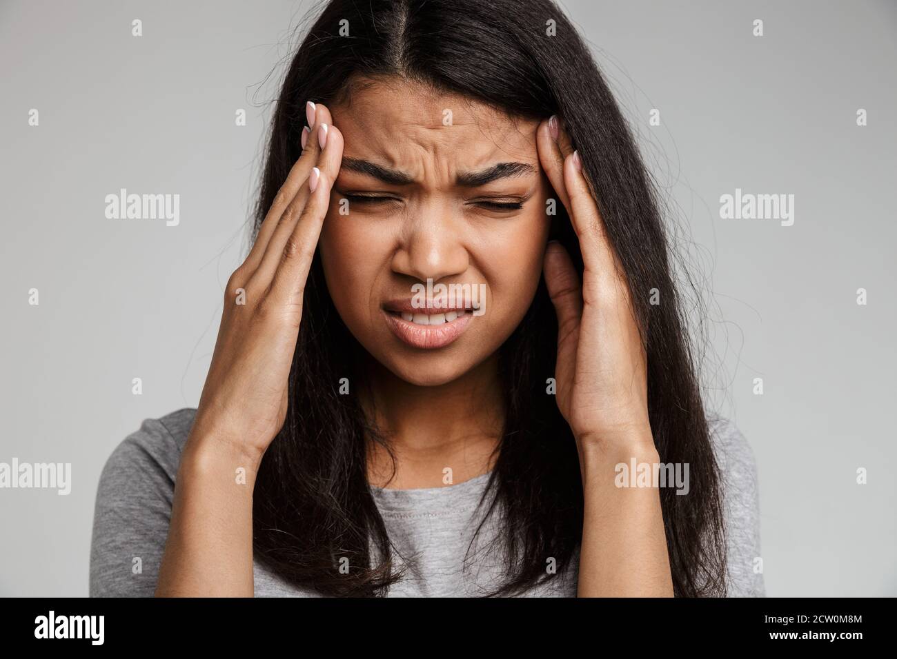 Portrait of young woman thinking deeply about something isolated on ...