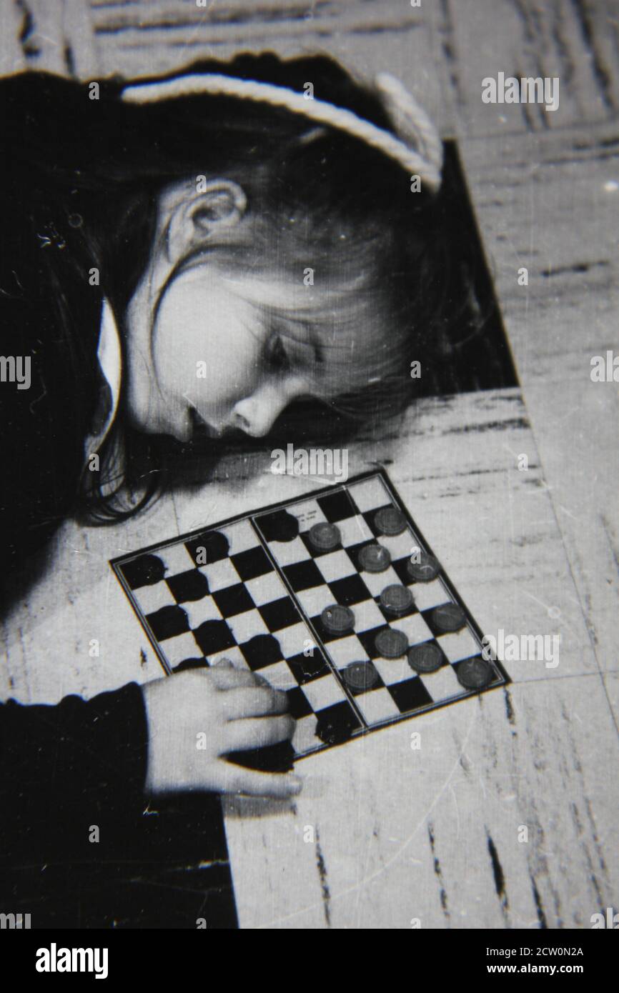 Fine 1970s vintage black and white photography of a girl playing ...