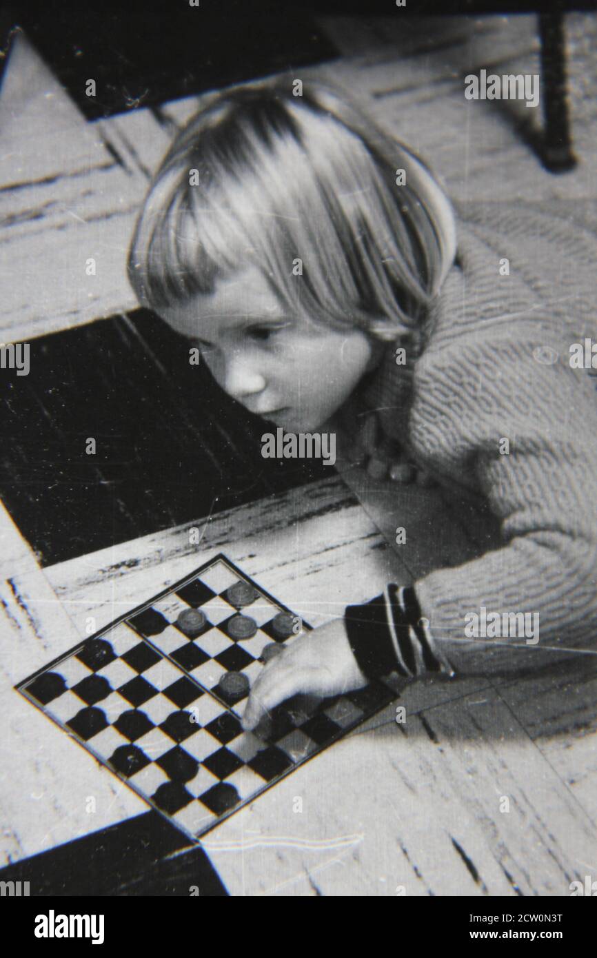 Fine 1970s vintage black and white photography of a girl playing ...