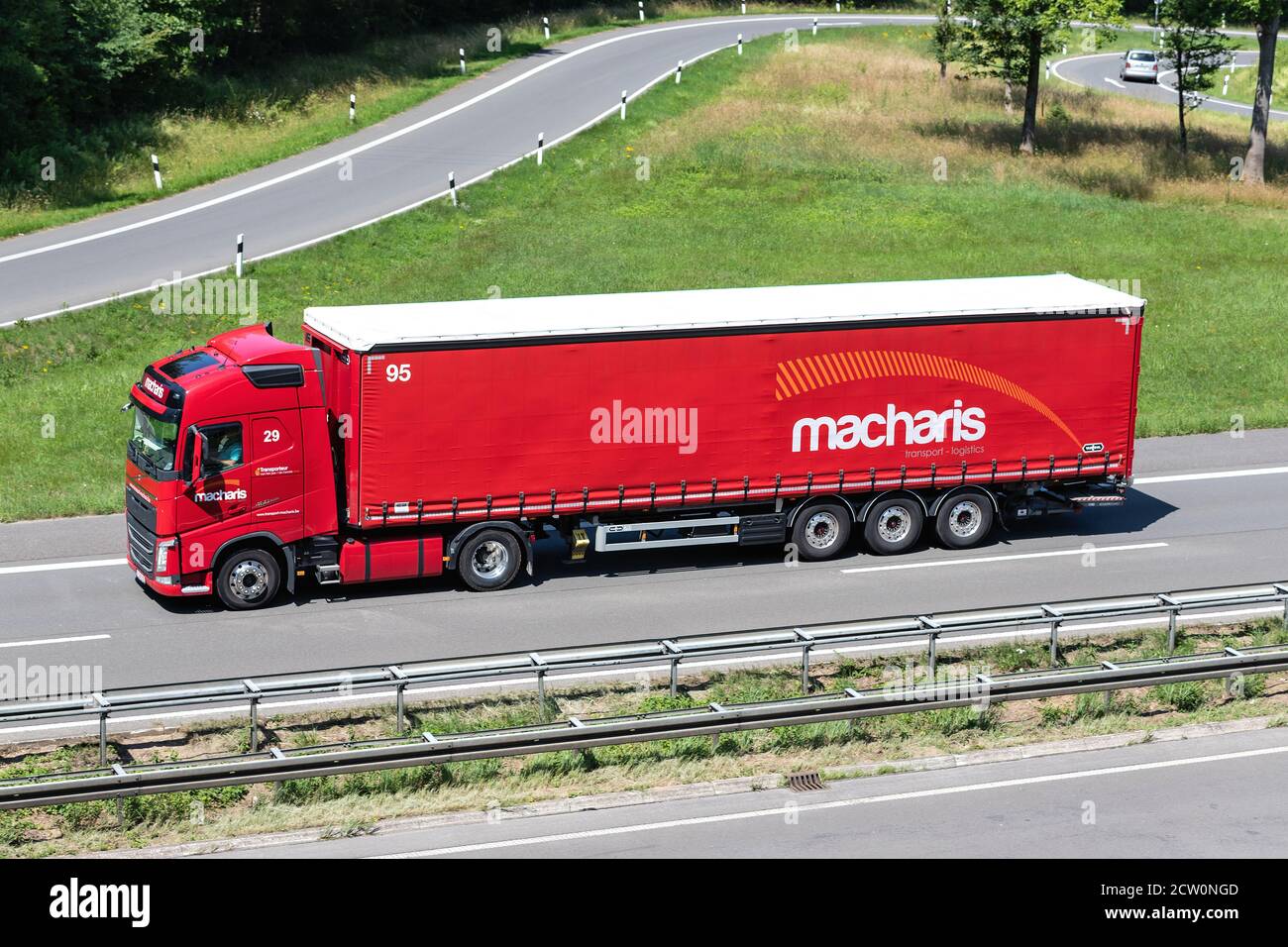 Macharis Volvo FH truck with curtainside trailer on motorway Stock ...