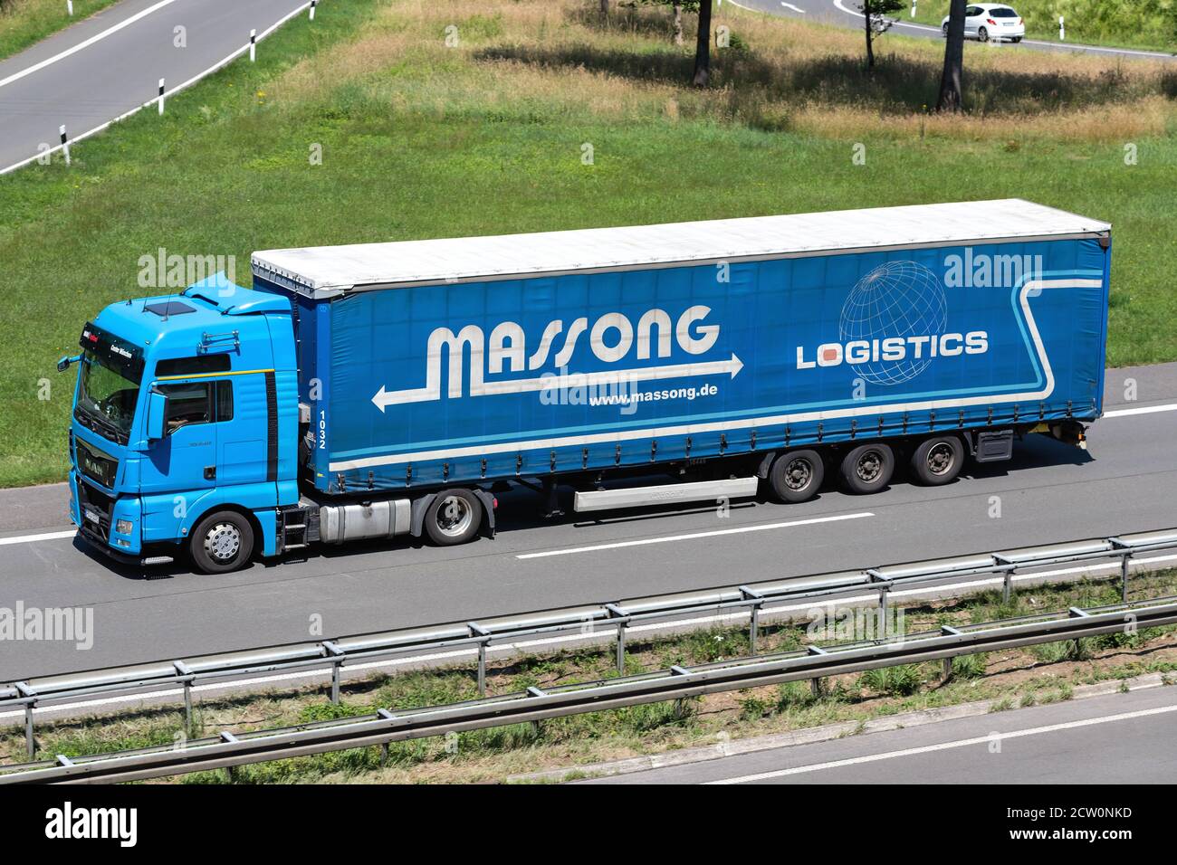 Massong MAN TGX truck with curtainside trailer on motorway Stock Photo ...