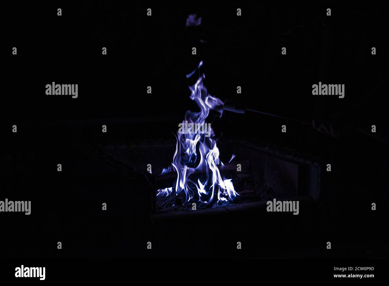 Beautiful shot of a purple blue flame in the dark Stock Photo - Alamy