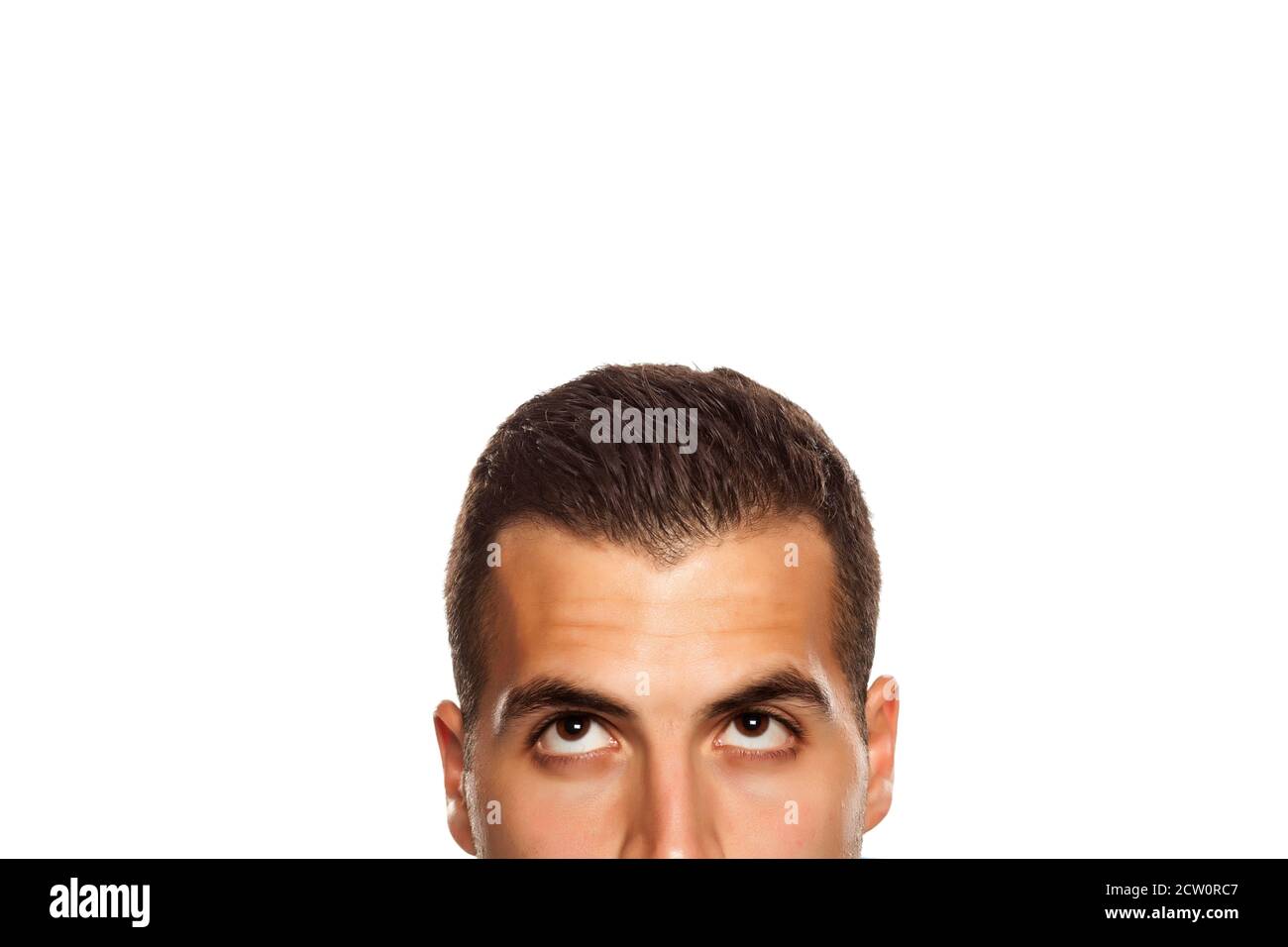 Half portrait of thinking young man on white background Stock Photo - Alamy