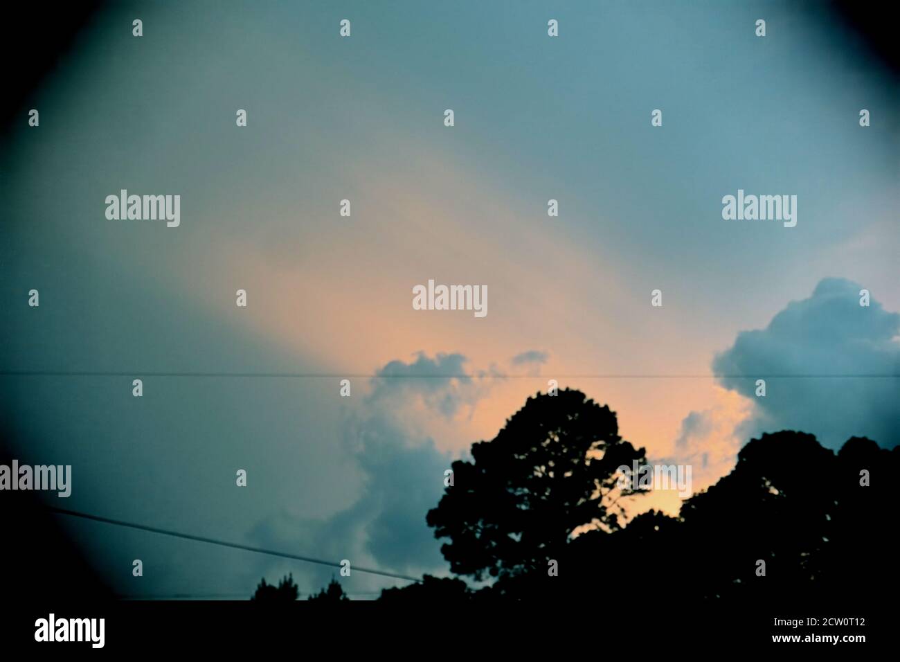 vignette of sun rays and clouds Stock Photo - Alamy