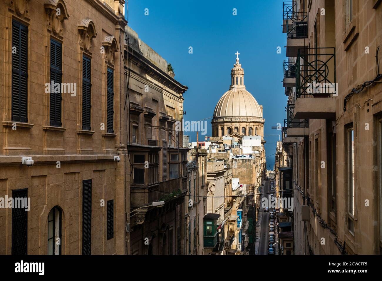 Street of Valletta with the basilica in the background, most beautiful ...