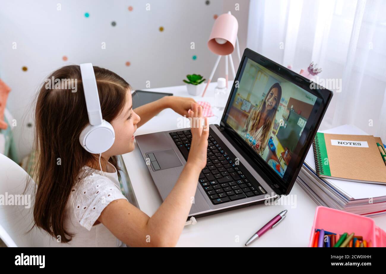 Girl watching online class of her teacher Stock Photo - Alamy