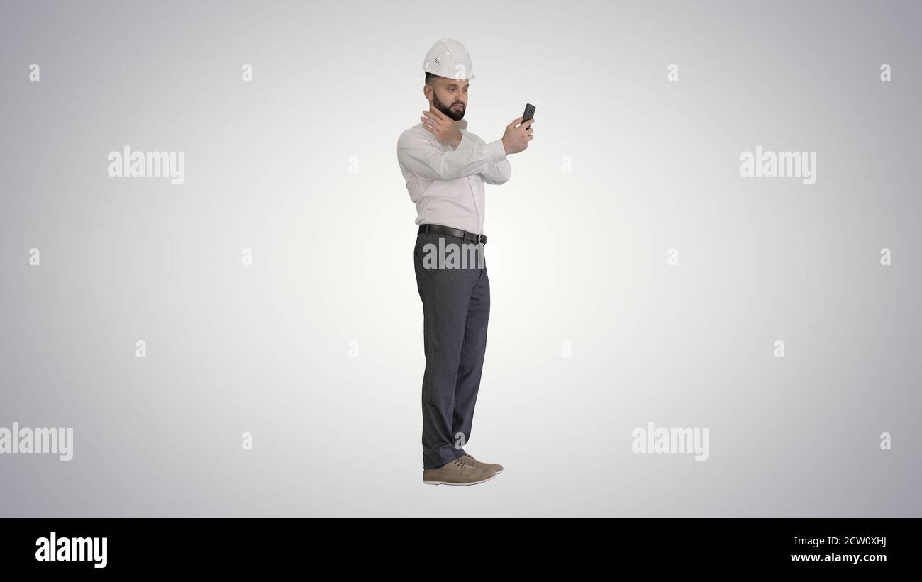 Man engineer wearing protecting safety helmet and shirt making v Stock ...