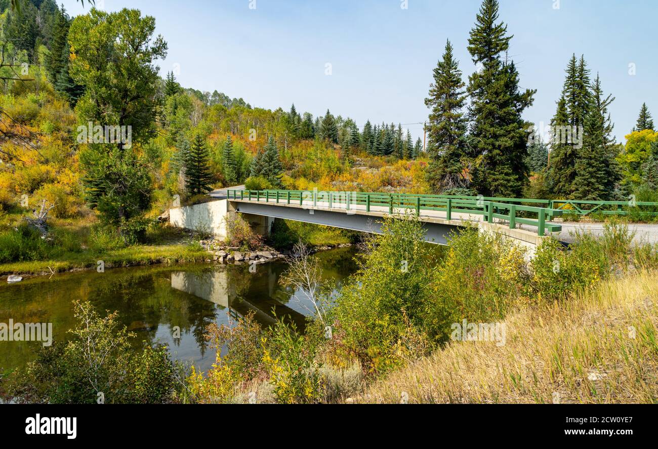 A small road bridge over a calm stream in a rural setting Stock Photo ...