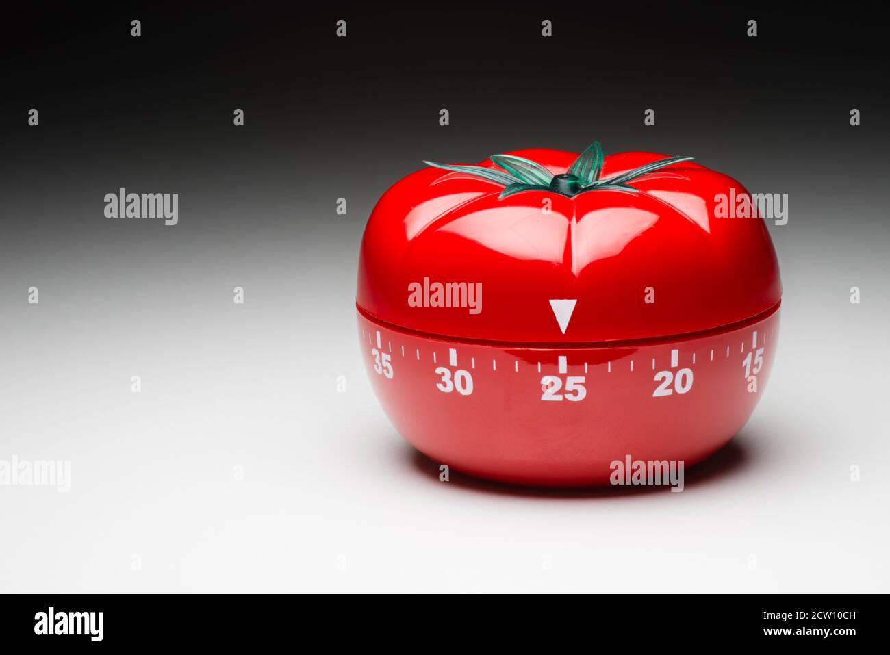 Tomato-shaped kitchen timer set at 25 minutes to fight procrastination ...