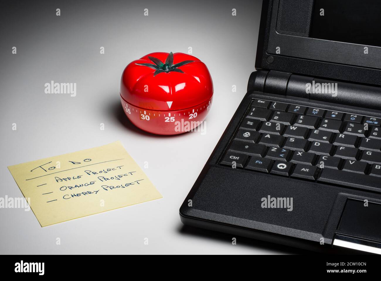 Tomato-shaped kitchen timer set at 25 minutes to fight procrastination ...