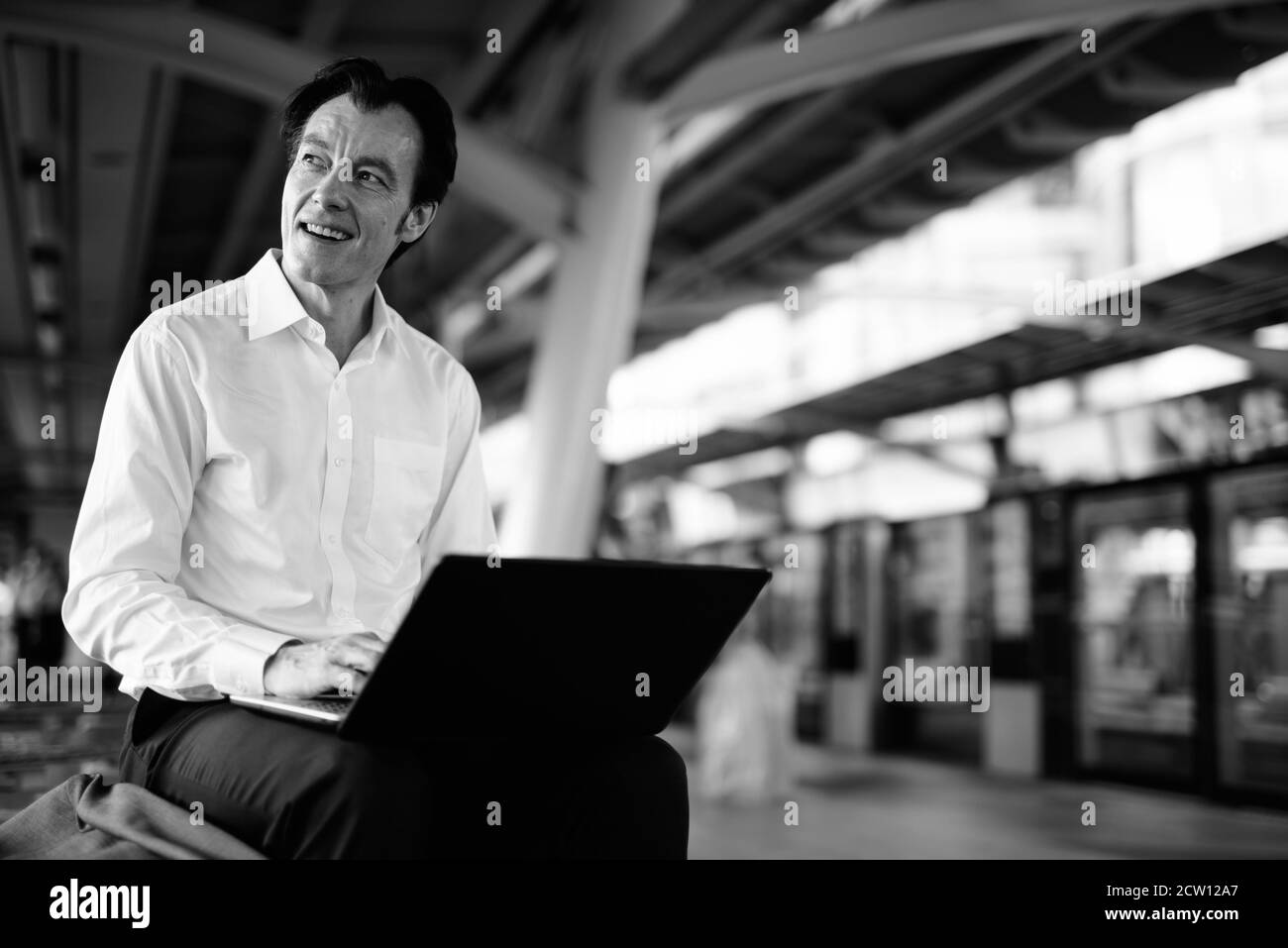 Mature handsome businessman exploring Black and White Stock Photos ...