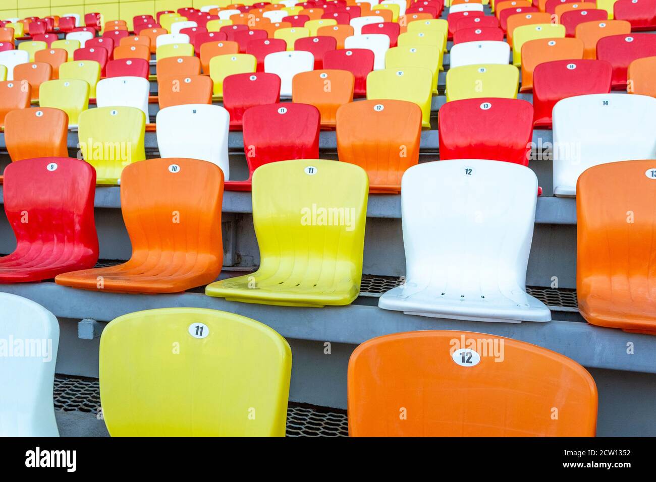 Colored stadium seats in a row - side view Stock Photo - Alamy