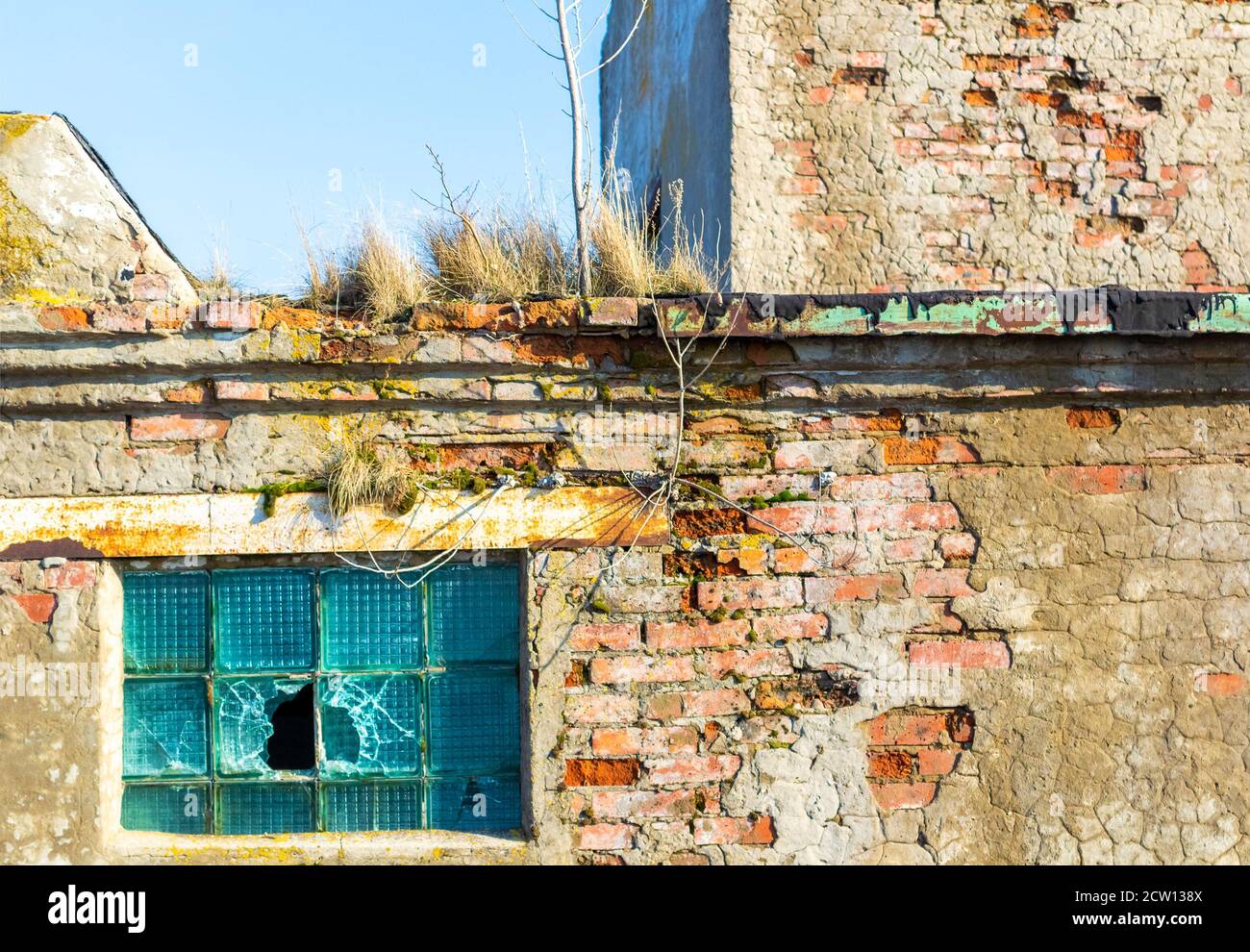 Grunge damaged broken windows in brick ruined building wall Stock Photo ...