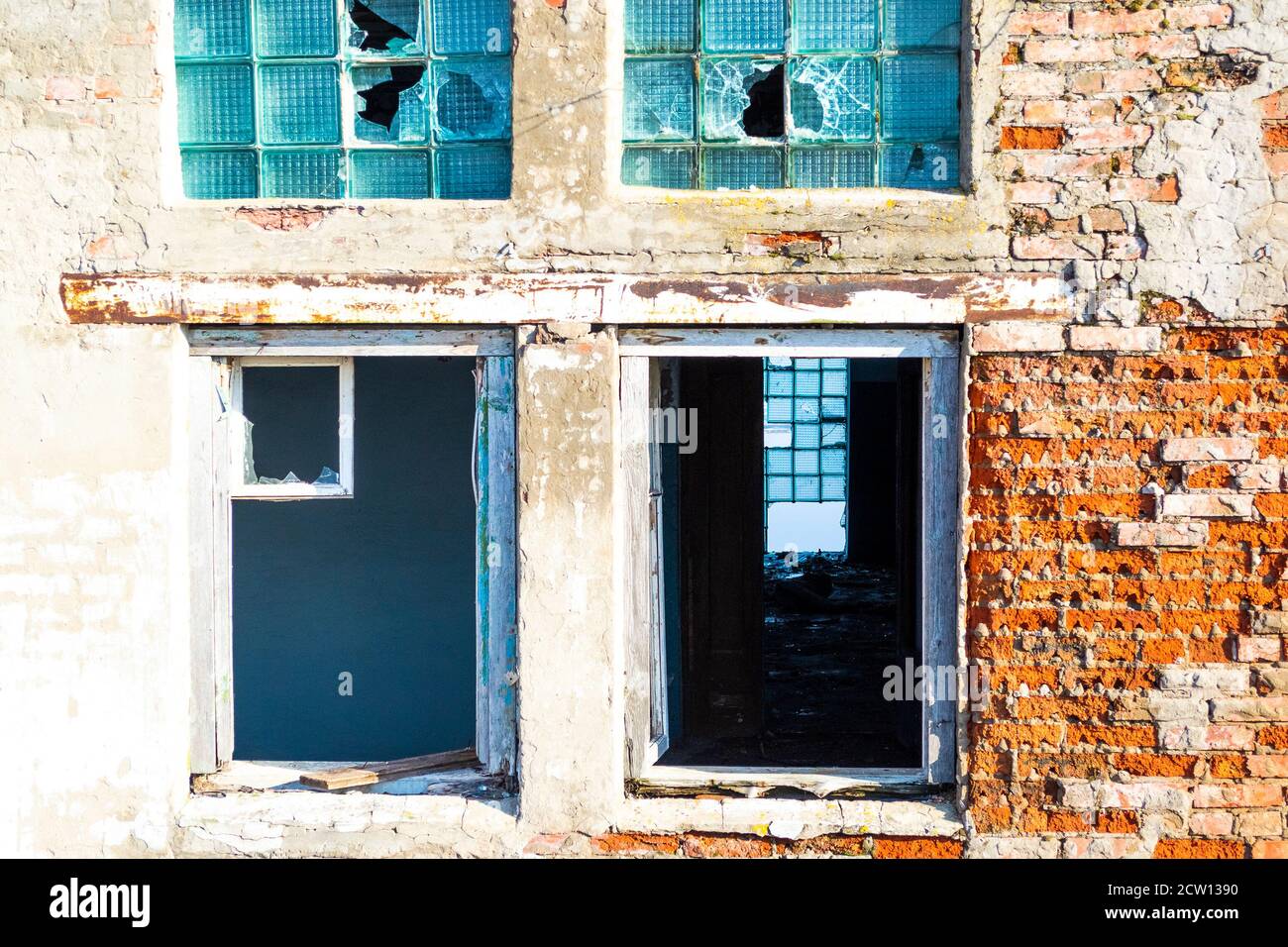 Grunge damaged broken windows in brick ruined building wall Stock Photo ...