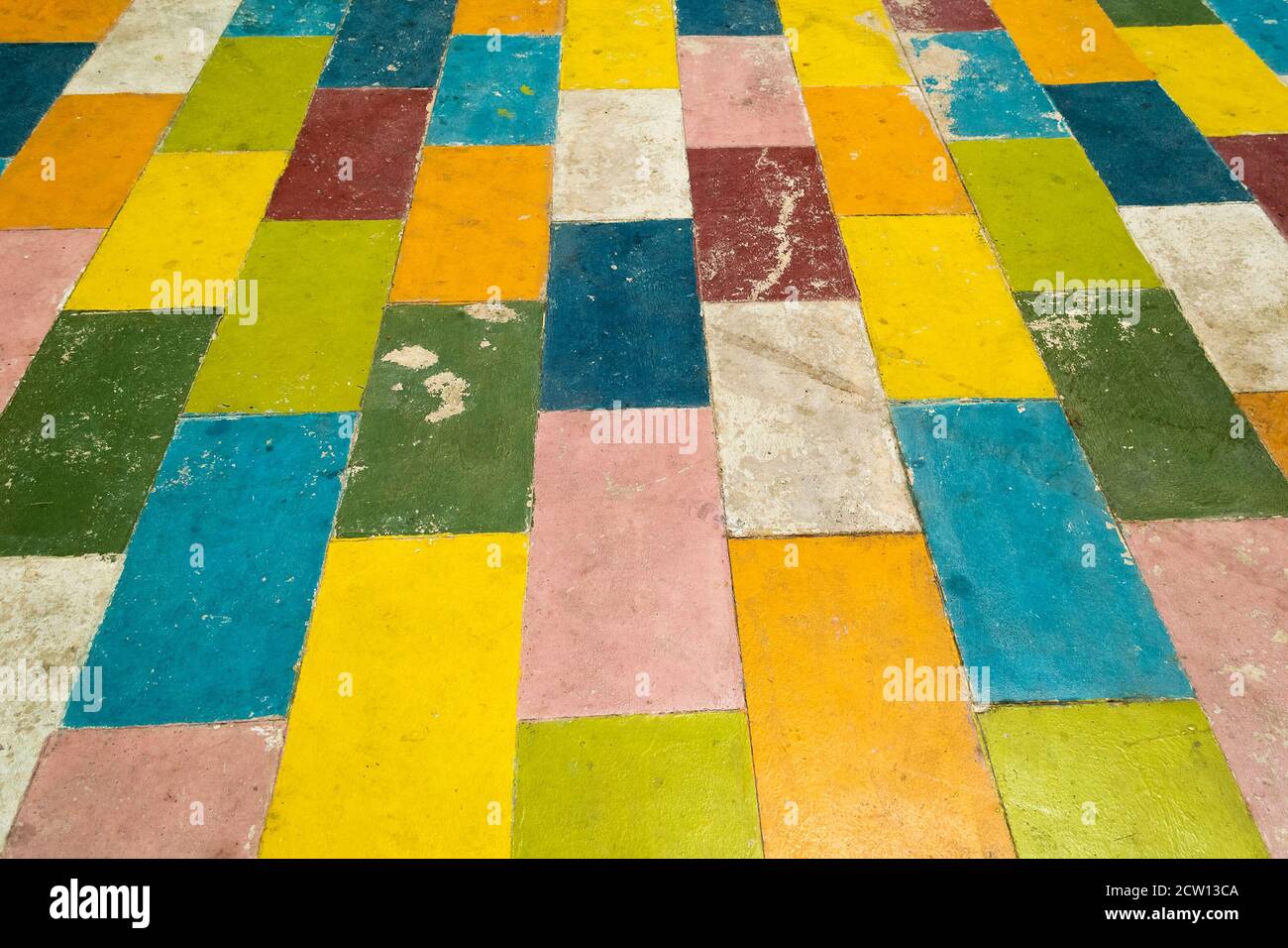 Perspective view on colorful tiles street pavement Stock Photo - Alamy
