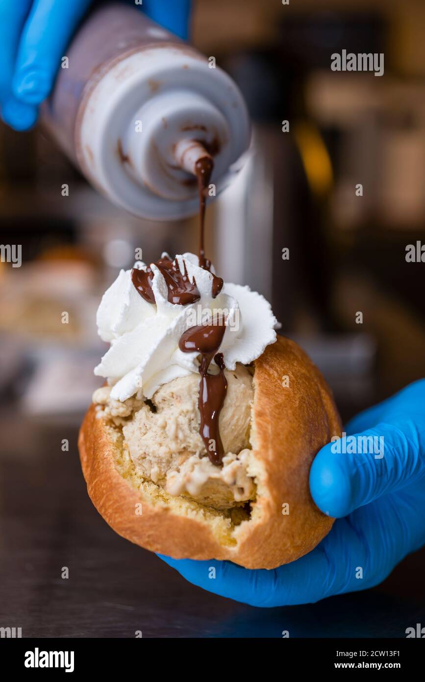 Artisan preparation of classic Italian maritozzo, sweet bun, with ice ...