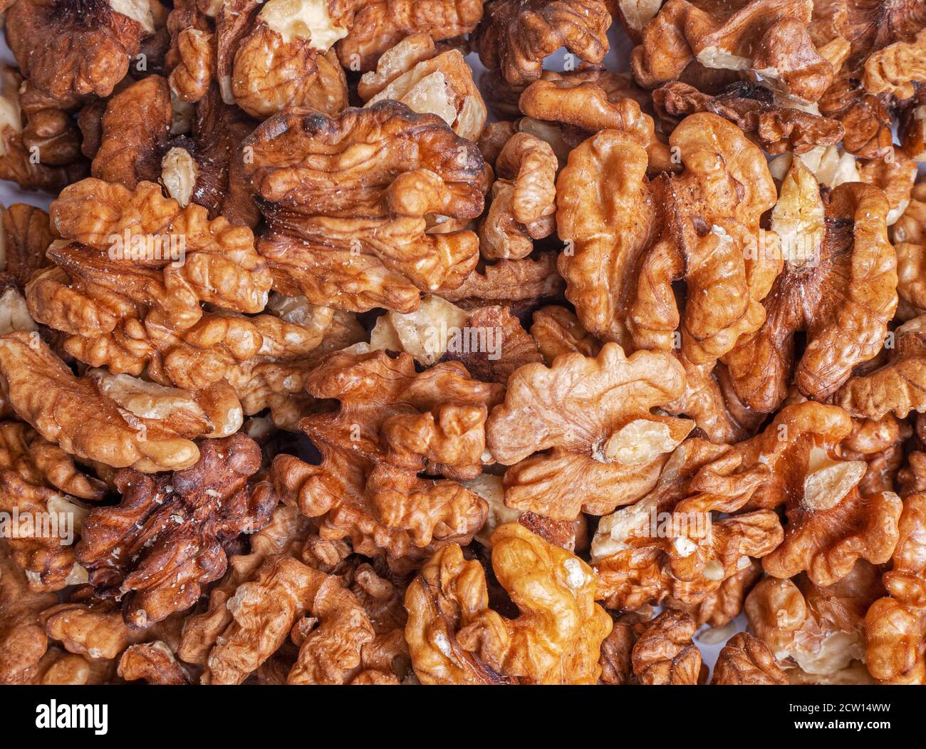 Stack of walnuts on white background Stock Photo - Alamy