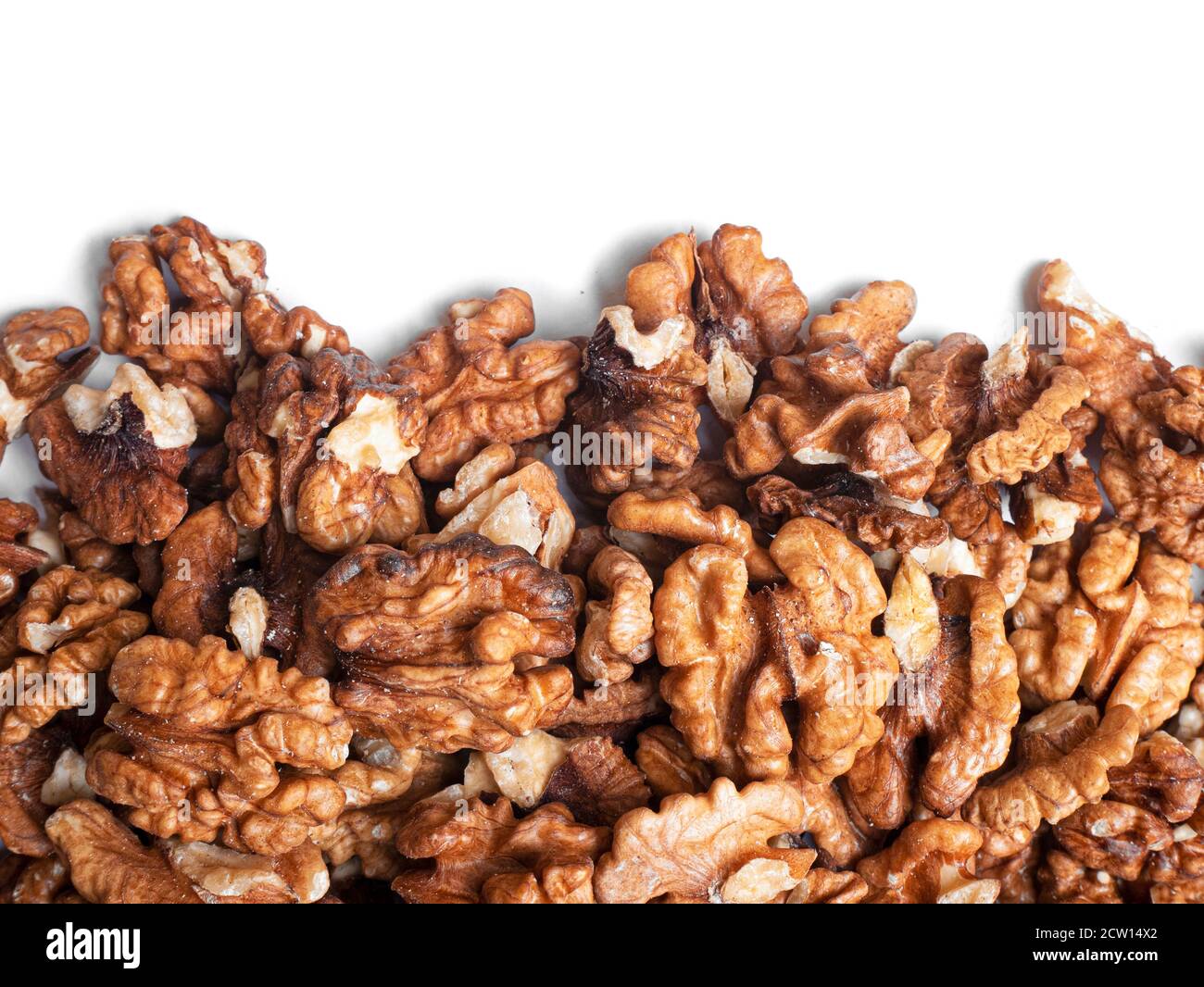 Stack of walnuts on white background Stock Photo - Alamy