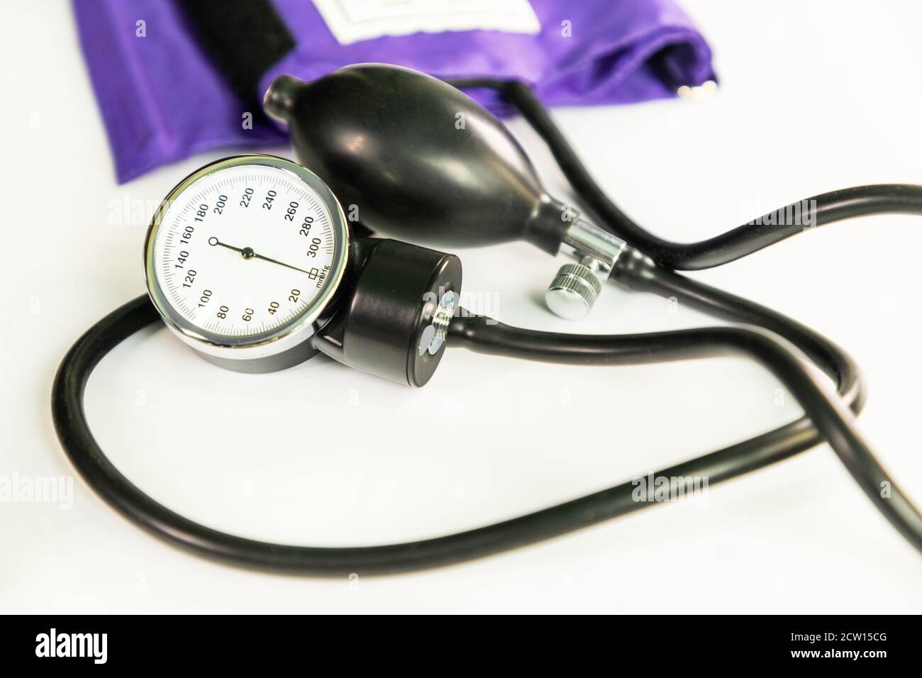 Purple color Sphygmomanometer on the table isolated Stock Photo - Alamy