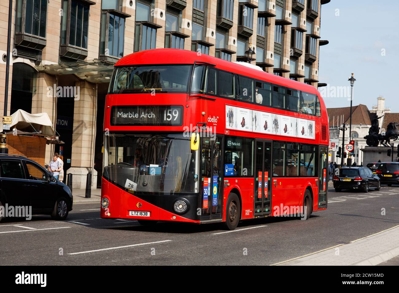 Red London bus driving off Westminster Bridge, London Stock Photo - Alamy