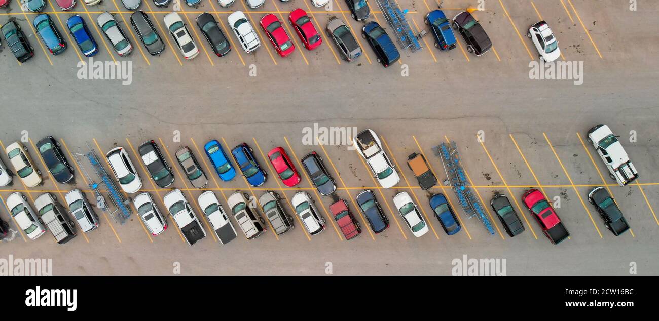 Aerial view of cars at large outdoor parking lots; USA. Outlet mall ...