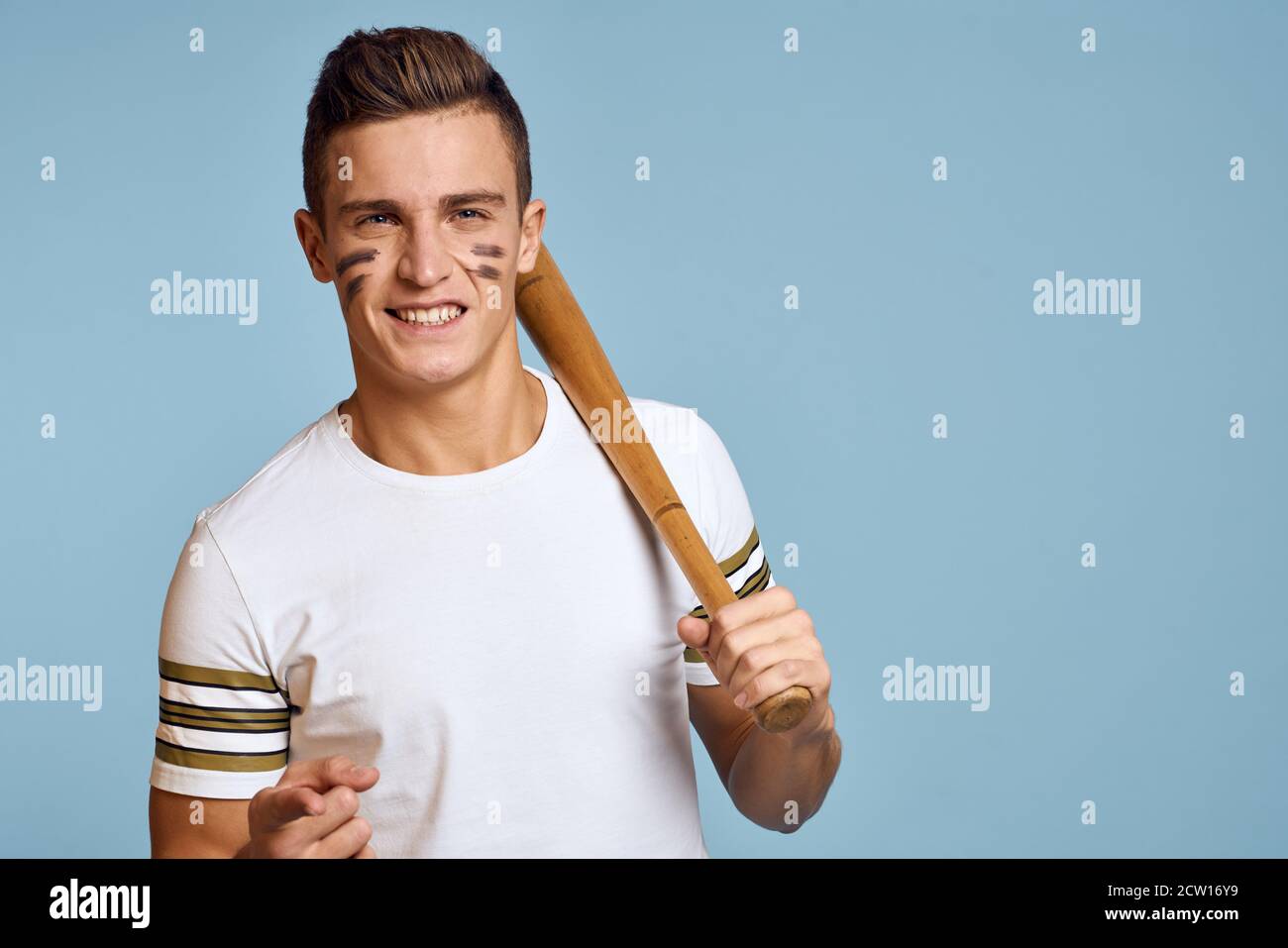 baseball guy with a bat in his hand on a blue background and a combat ...