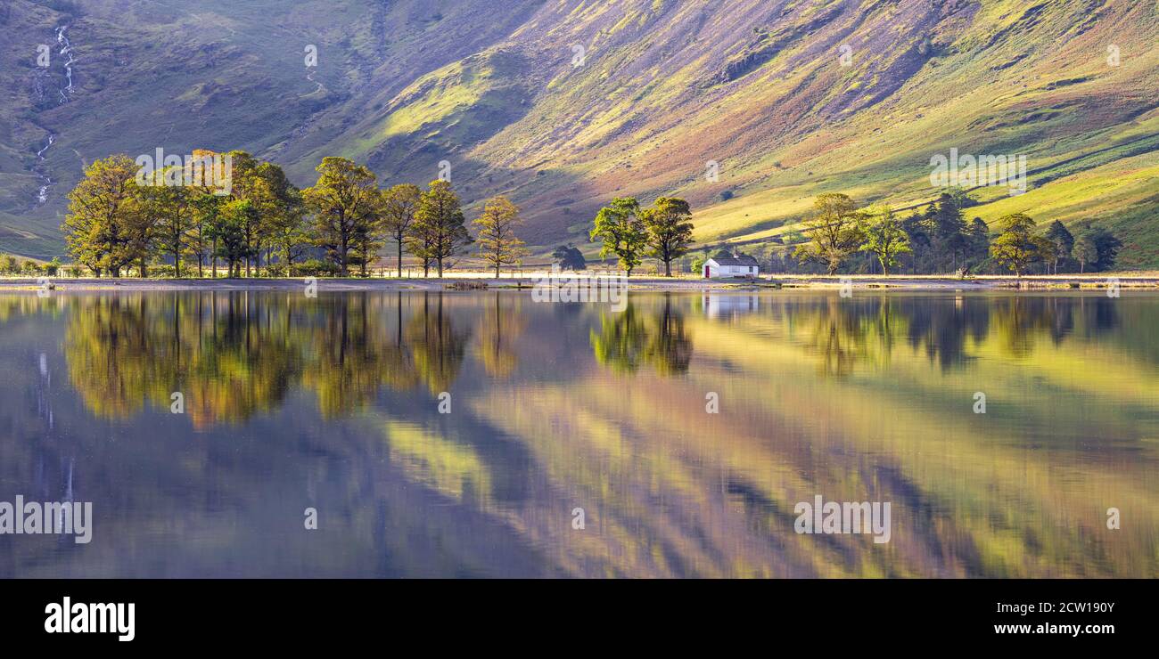 The famous Char Hut and Sentinel Trees at Buttermere are reflected in ...