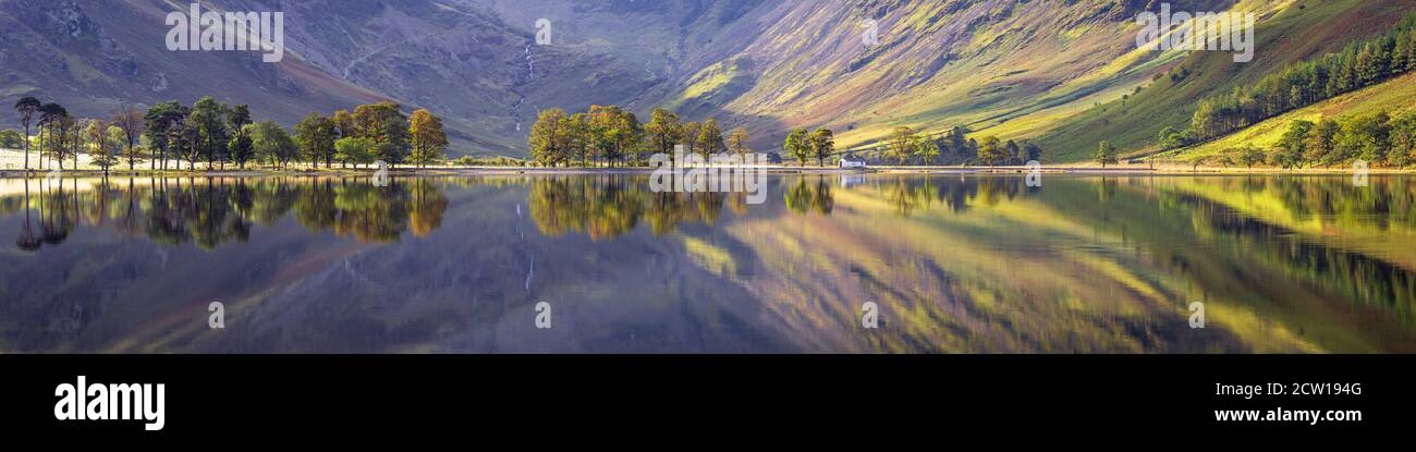 The famous Char Hut and Sentinel Trees at Buttermere are reflected in ...
