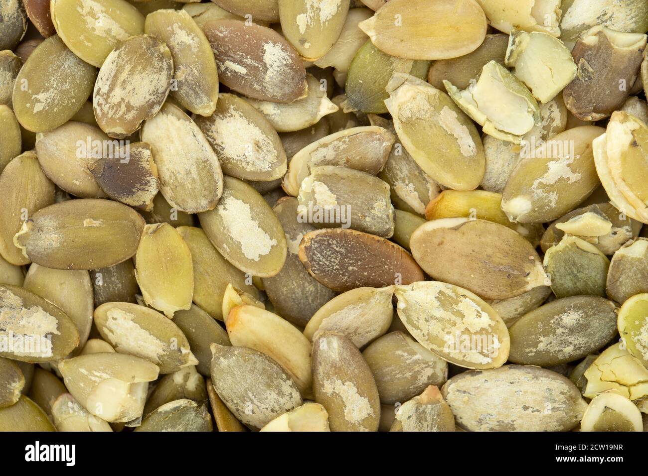 Macro background texture of green pumpkin seeds. Top view Stock Photo ...