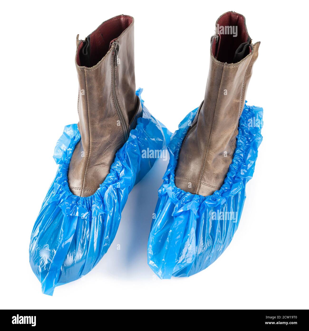 Blue protective shoe covers on female shoes isolated on white ...