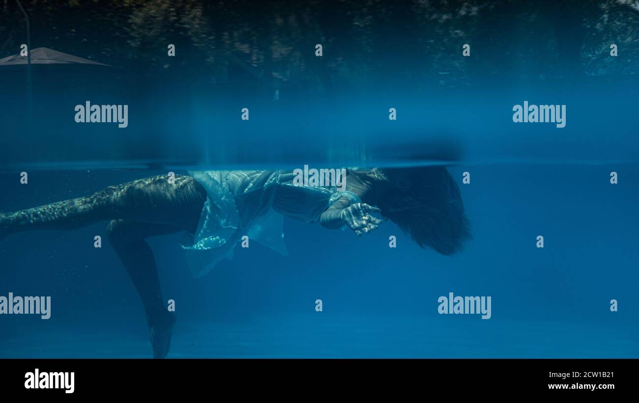 Woman drowning in pool hi-res stock photography and images - Alamy
