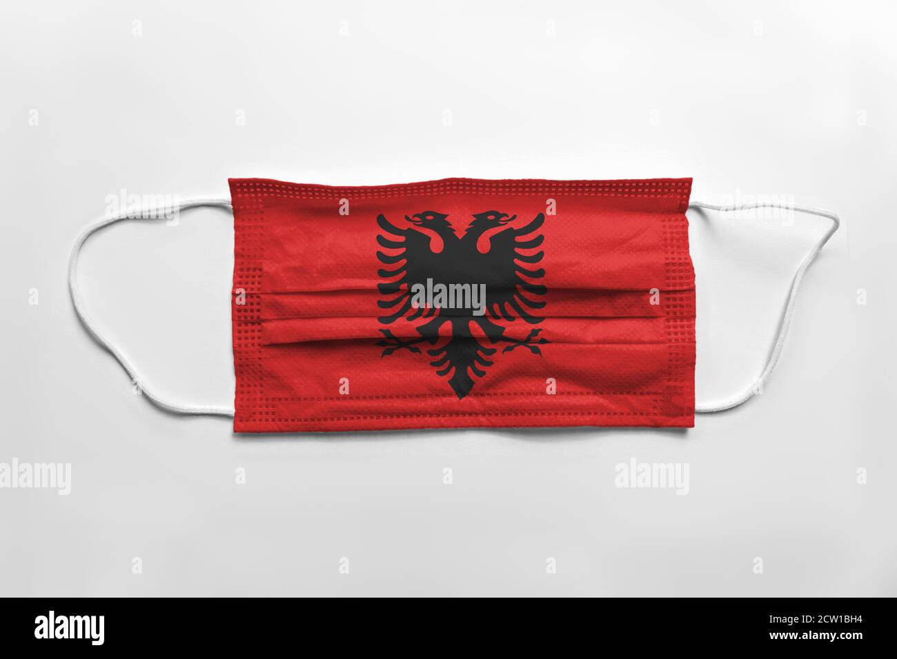 Face mask with Albania flag printed, on white background, isolated ...