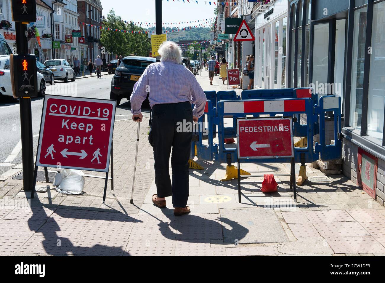 Marlow, Buckinghamshire, UK. 25th June, 2020. An elderly man walks past ...