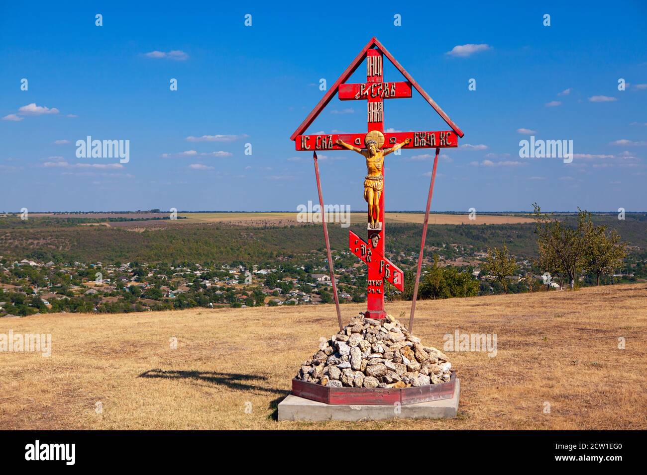 Monument of the Crucifixion of Jesus Christ . Red orthodox Cross with ...