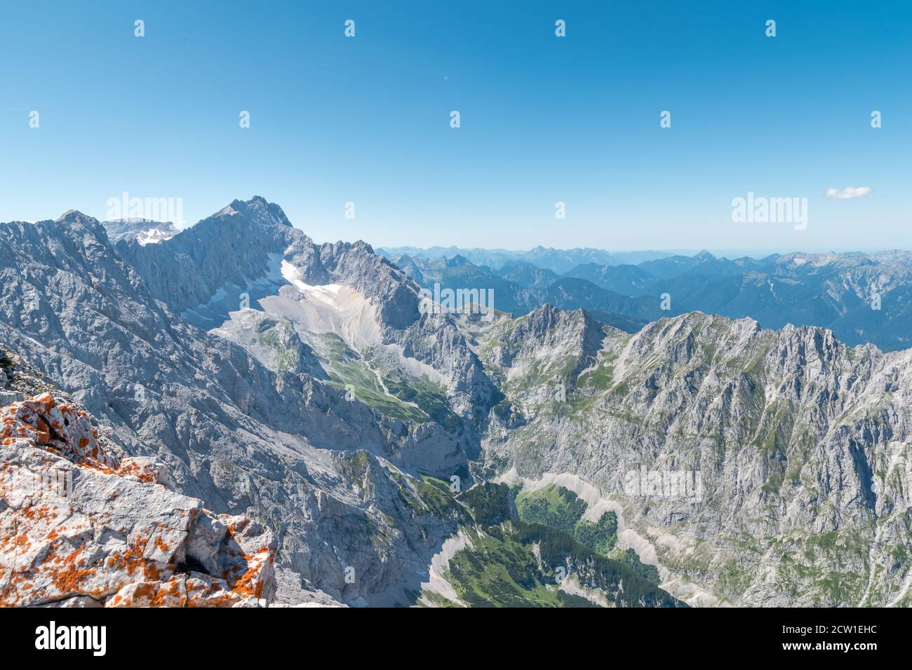 View from the summit of the mountain Alpspitze to the famous Zugspitze ...