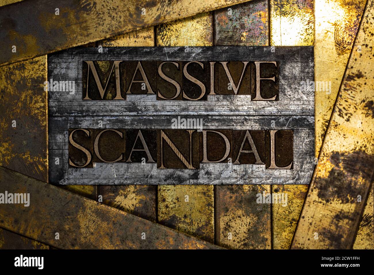 Massive Scandal text message on textured grunge copper and vintage gold ...