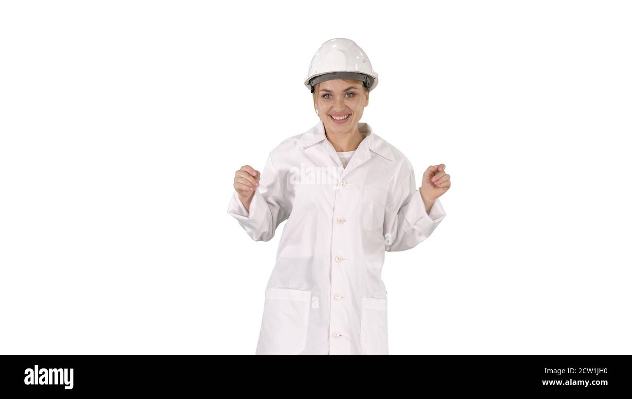 Female engineer dancing on white background Stock Photo - Alamy