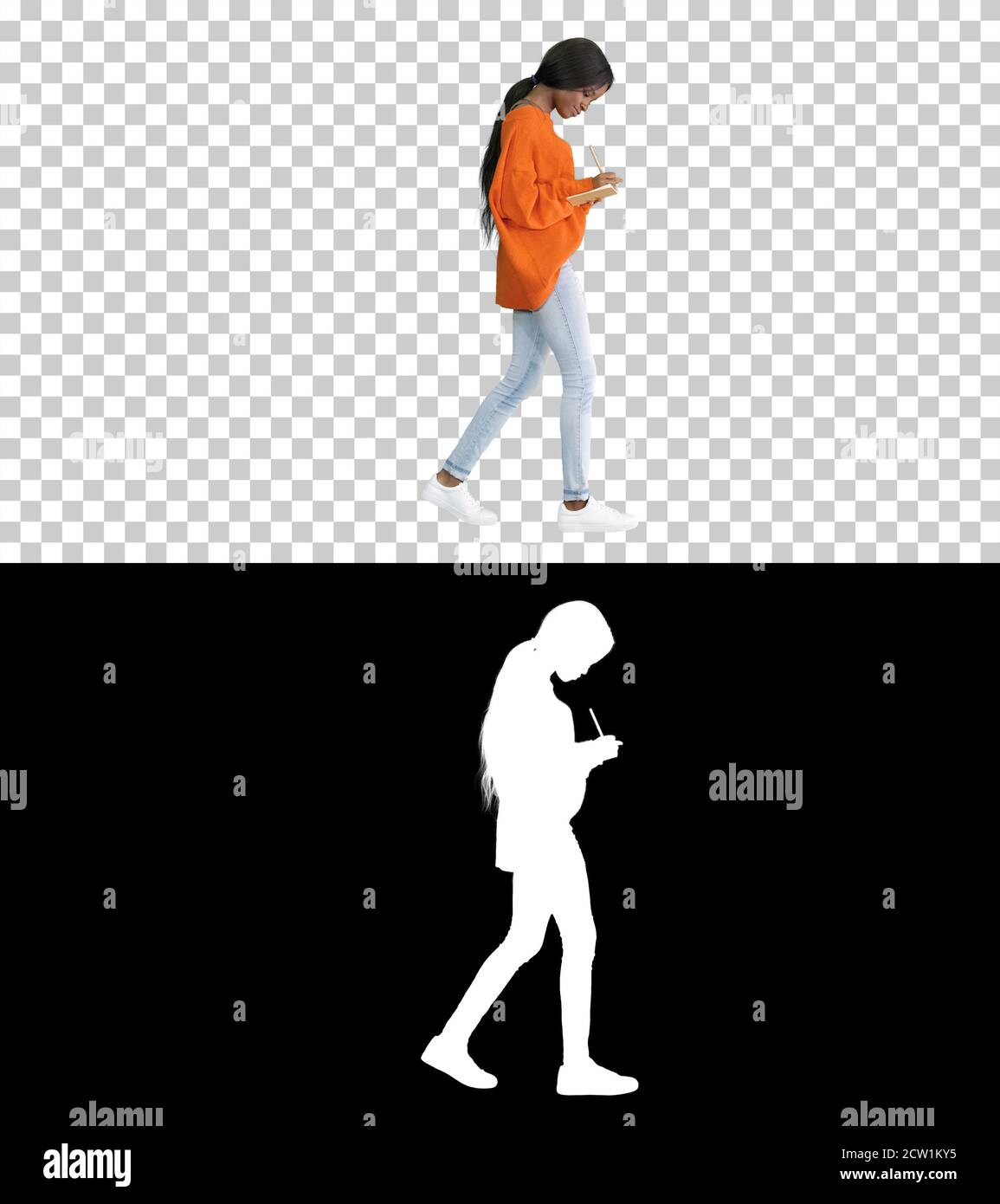 Pretty african american woman in bright jumper writing in her no Stock ...