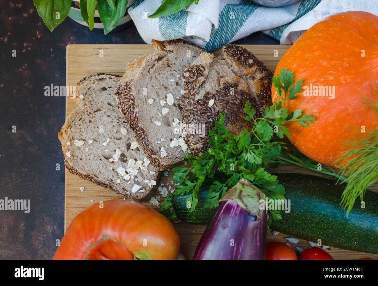 Assortment of fresh vegetables and fruits on a wooden board Stock Photo ...