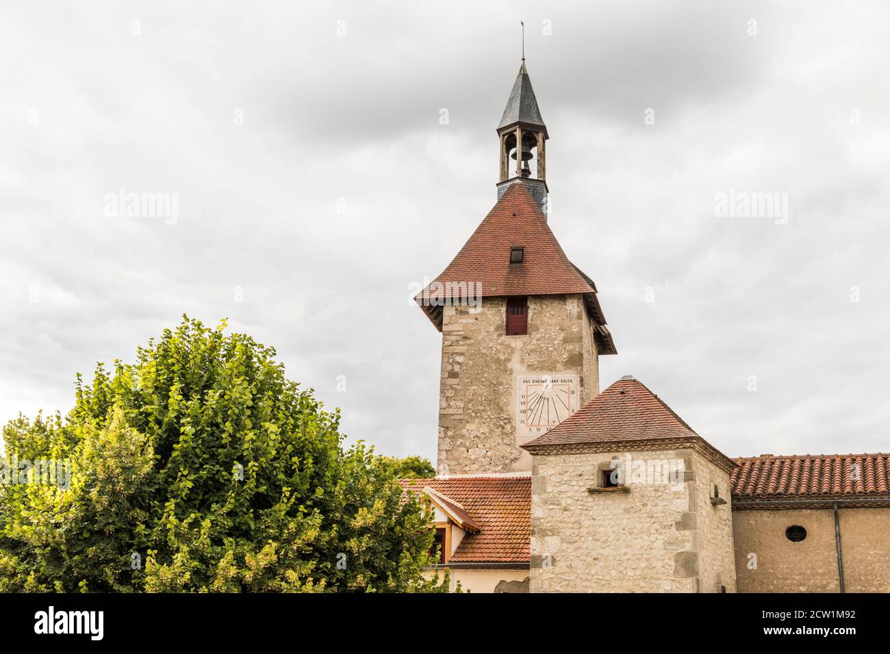 Charroux, France. Half-timbered house and church tower in one of the ...