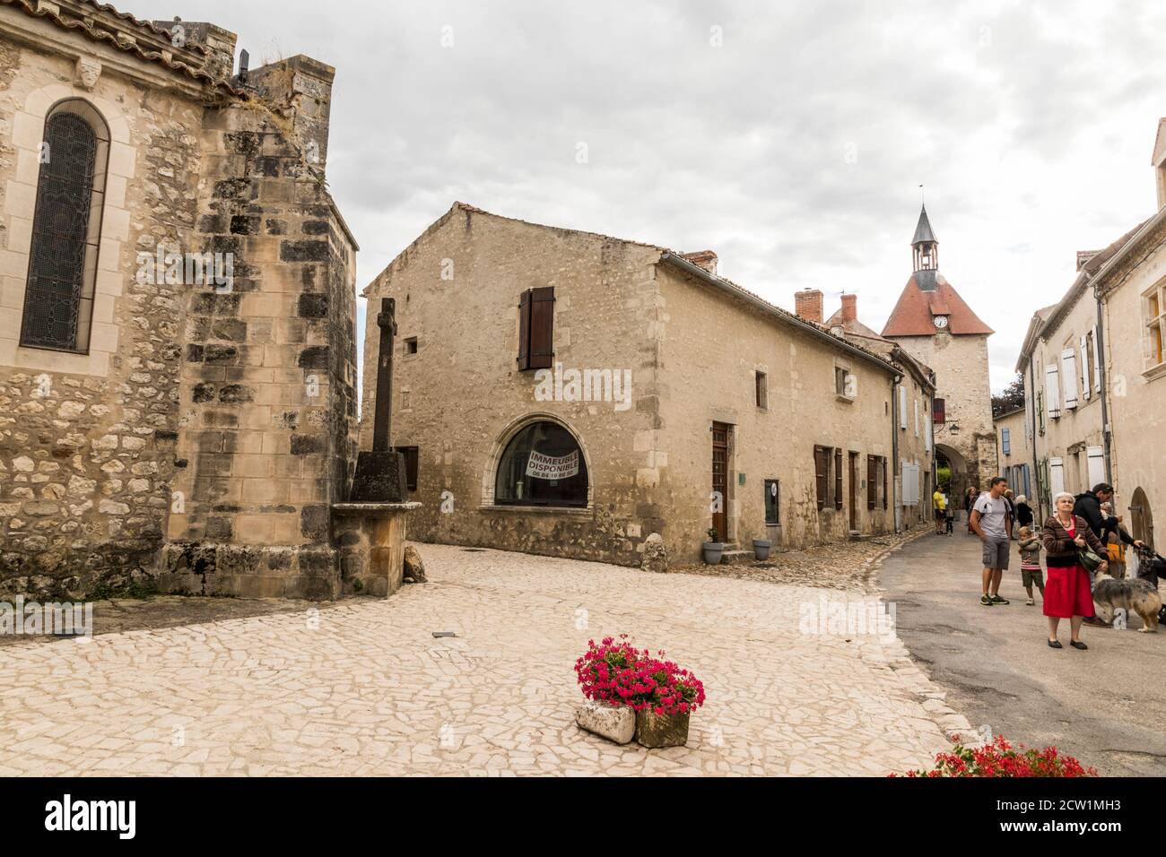 Charroux, France. Half-timbered house and church tower in one of the ...
