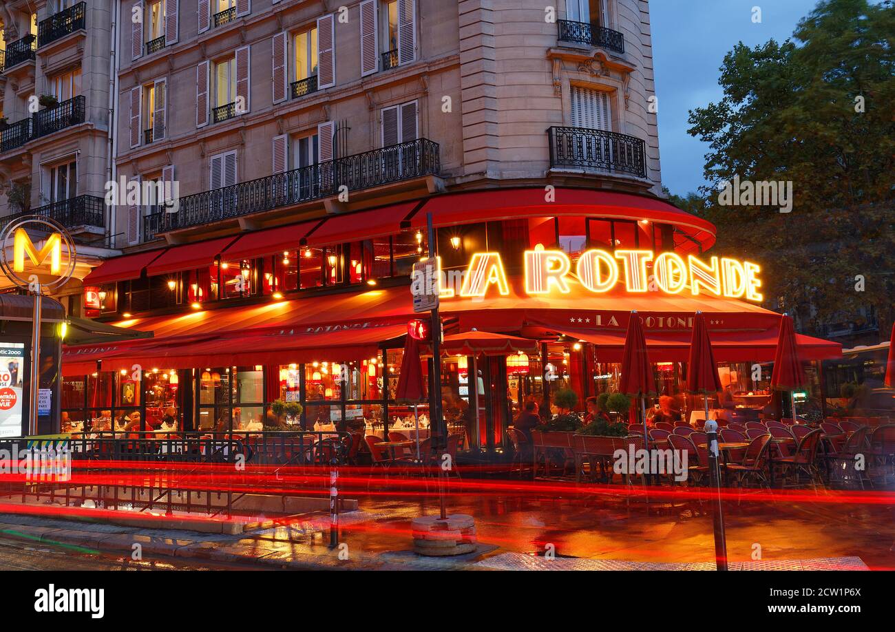 The famous cafe La Rotonde at rainy night , Paris, France Stock Photo ...