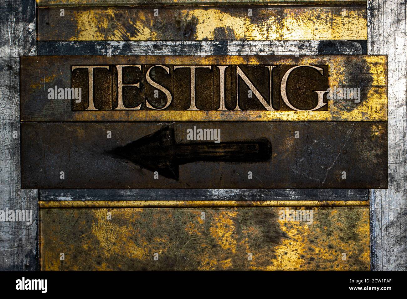 Testing sign with black charcoal arrow on textured grunge copper and ...