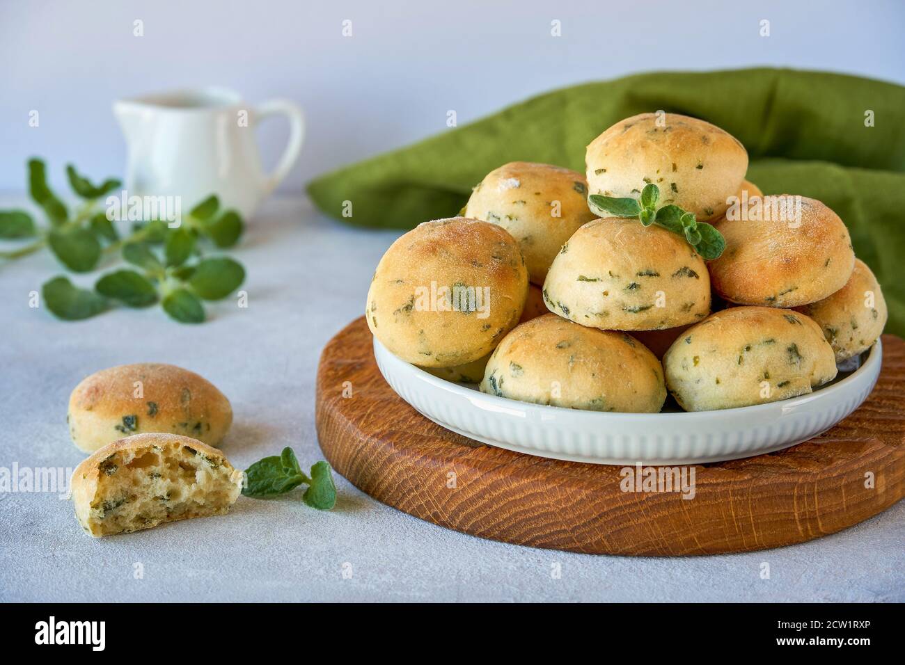 Homemade buns with fresh zaatar, oregano leaves Stock Photo - Alamy