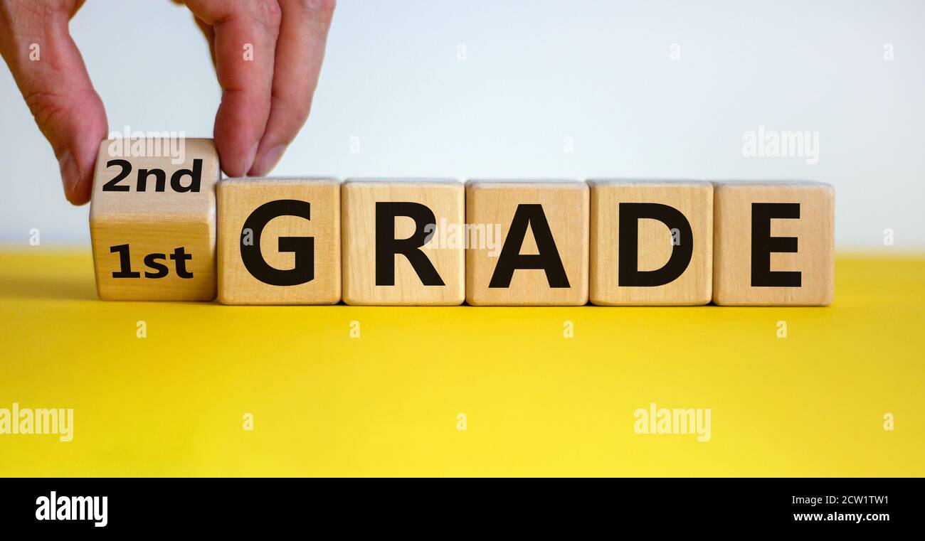 Hand turns a cube and changes the expression '1st grade' to '2nd grade ...