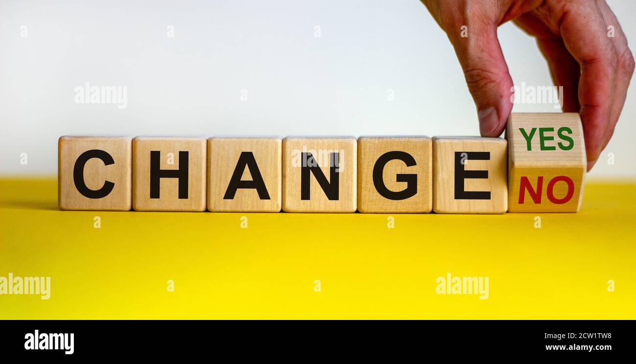 Hand turns a cube and changes the expression 'change no' to 'change yes ...