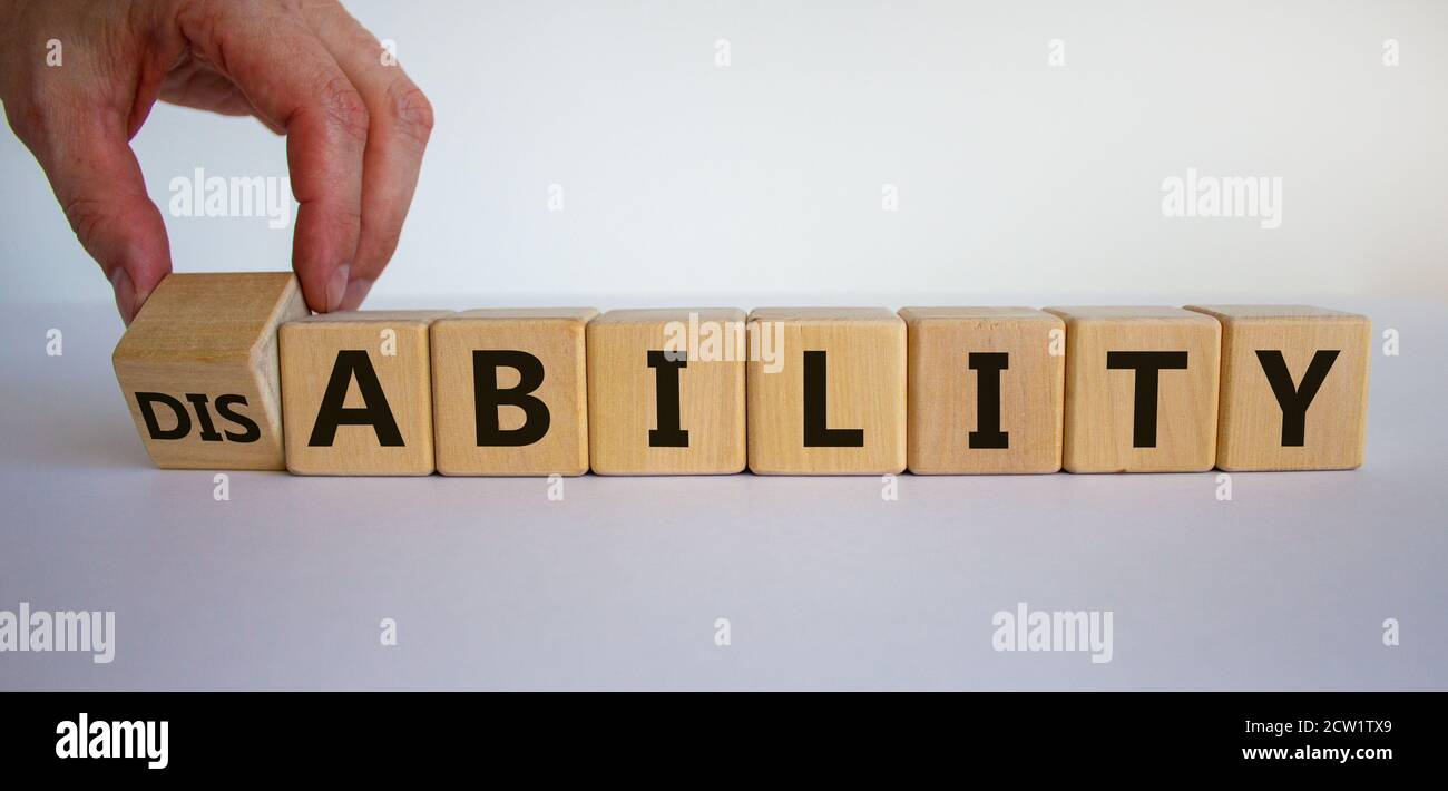 Hand turns a cube and changes the expression 'disability' to 'ability ...