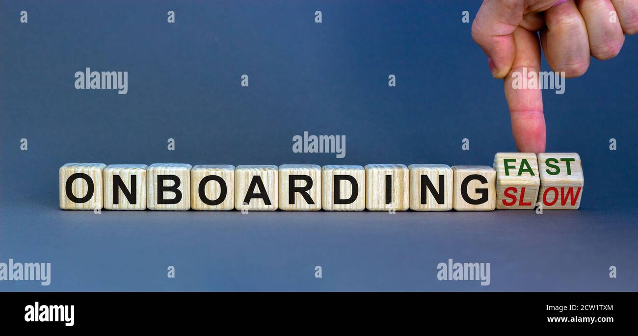 Hand turns cubes and changes words 'onboarding slow' to 'onboarding ...