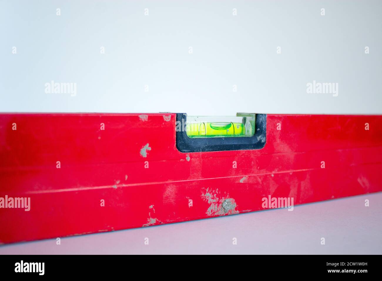 Building tool level. Red water level tool isolated on white background ...