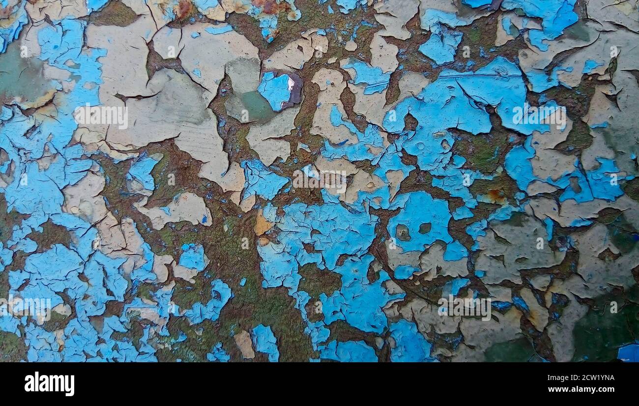 Abstract background of old peeling paint on the wall. Old paint on the ...